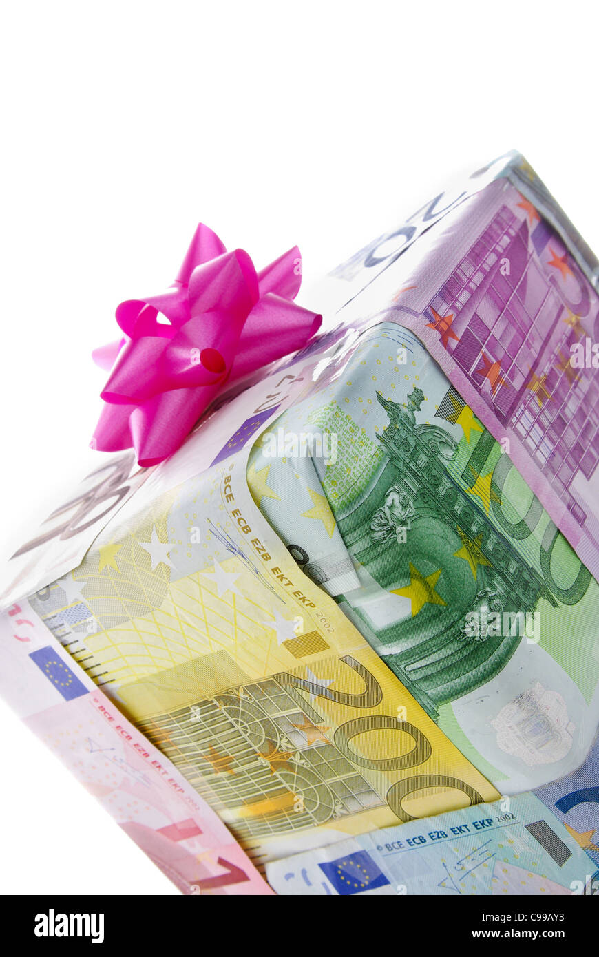 Different euro bills packed as a present isolated on a white background ...