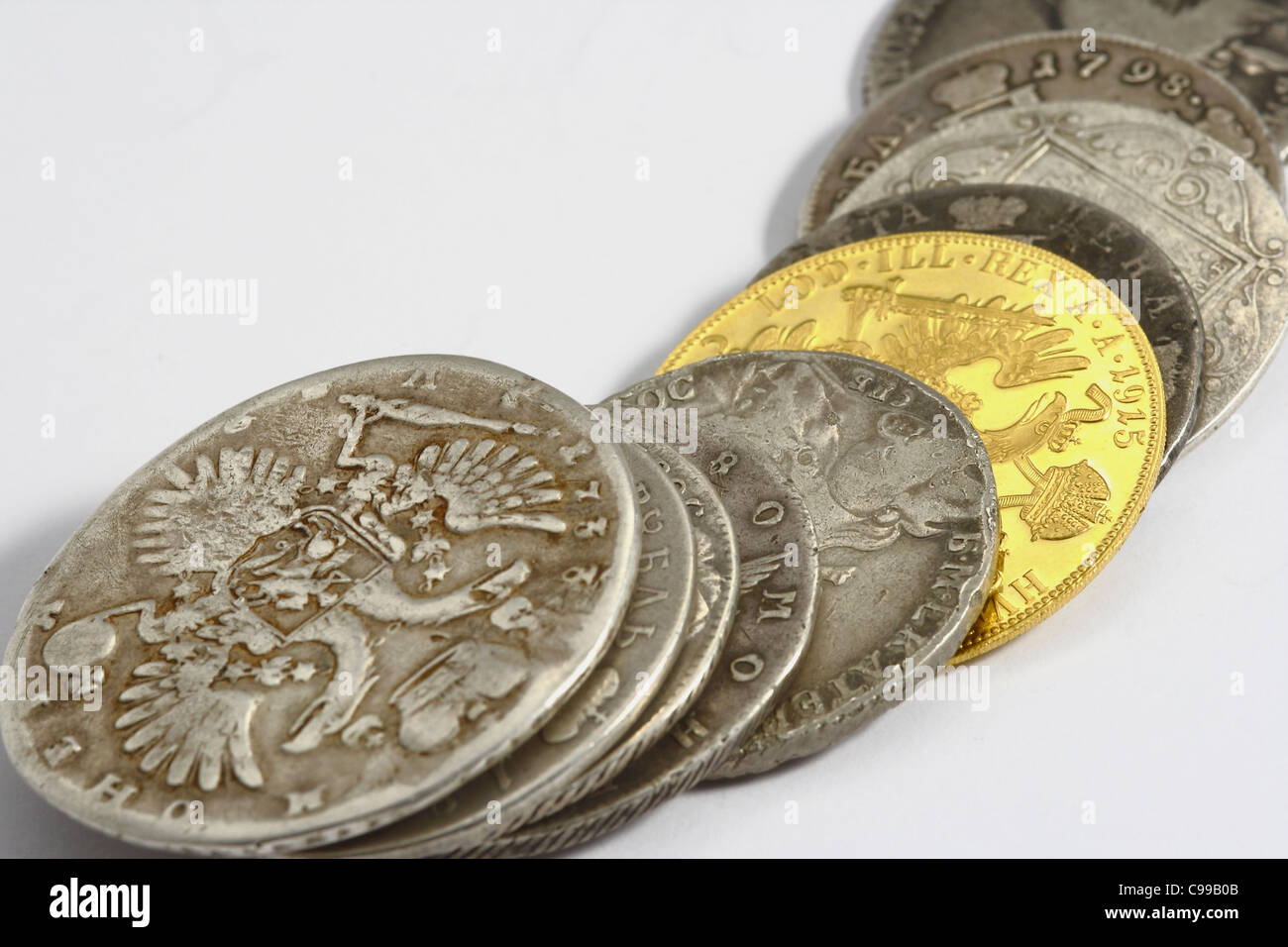 ancient coins on the white background Stock Photo - Alamy