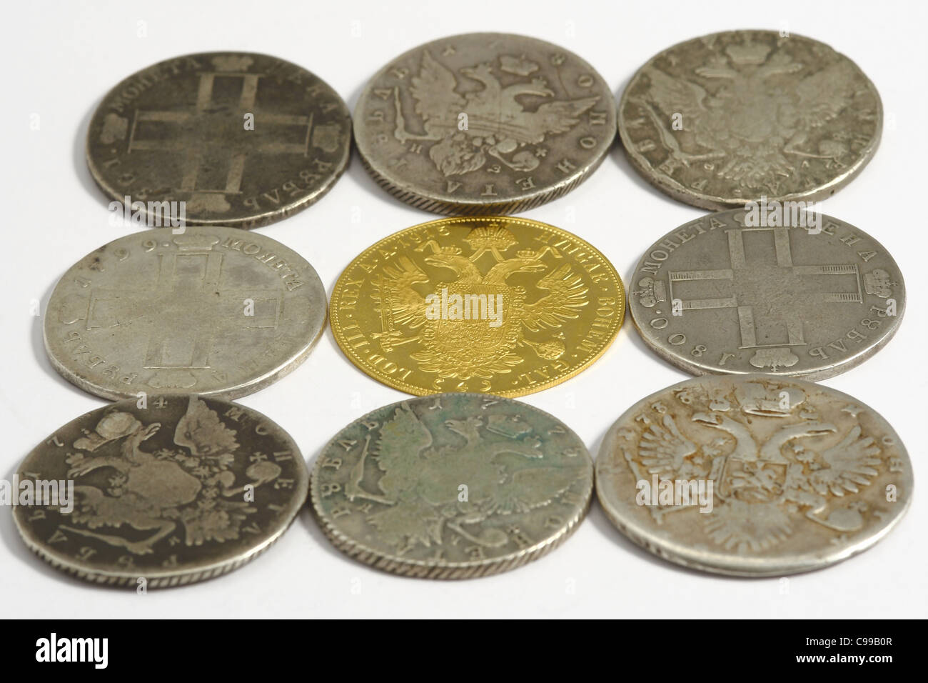 ancient coins on the white background Stock Photo - Alamy