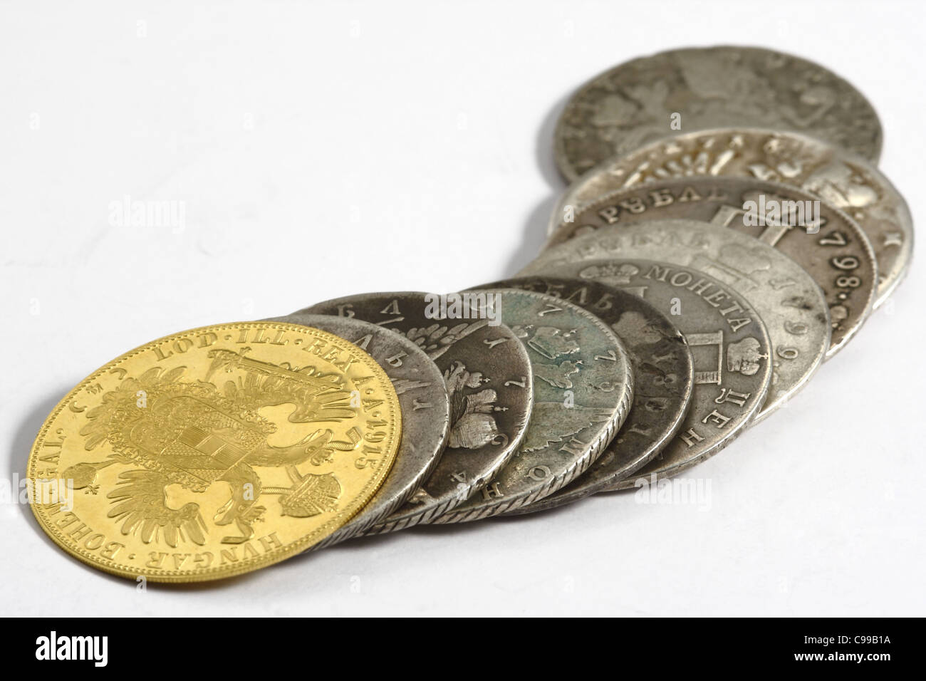 ancient coins on the white background Stock Photo - Alamy