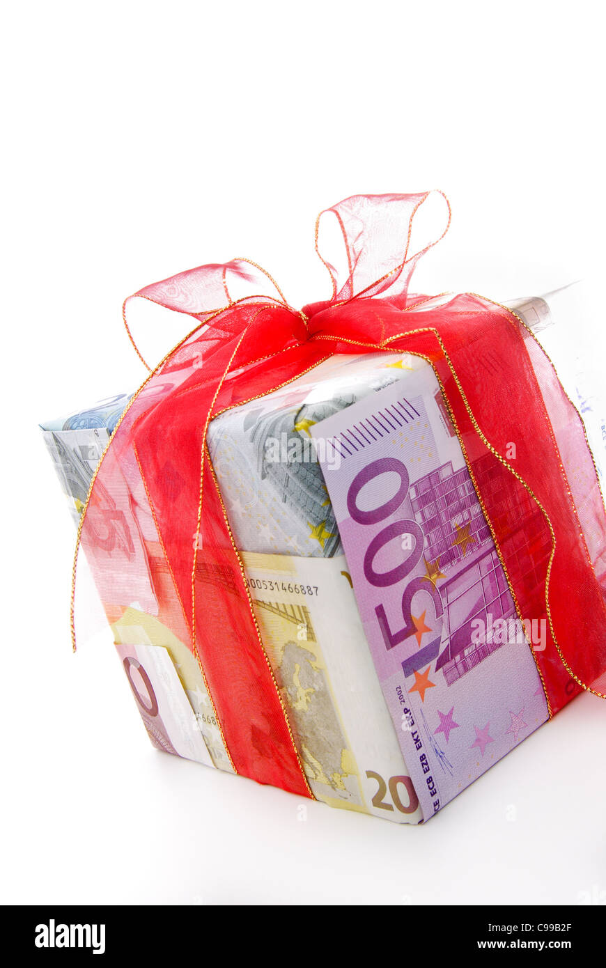 Different euro bills packed as a present isolated on a white background ...