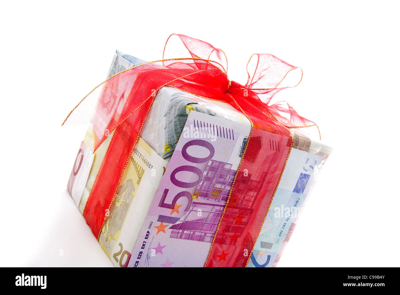 Different euro bills packed as a present isolated on a white background ...