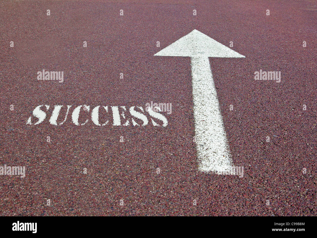an arrow on the asphalt showing the success direction Stock Photo - Alamy