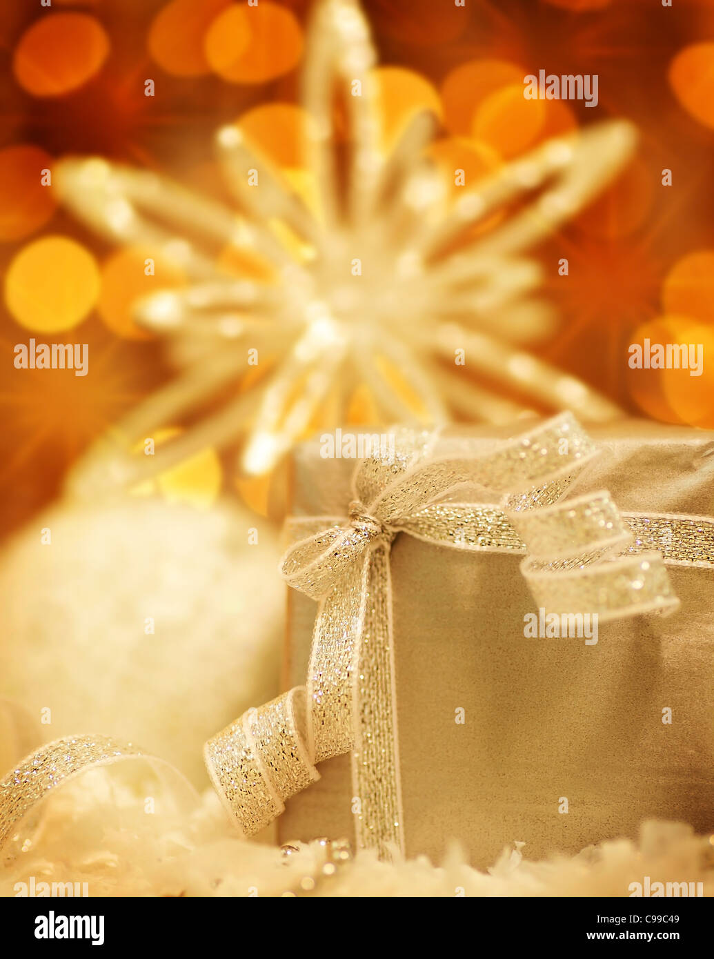 Winter holiday background with silver present gift box, star ornament ...