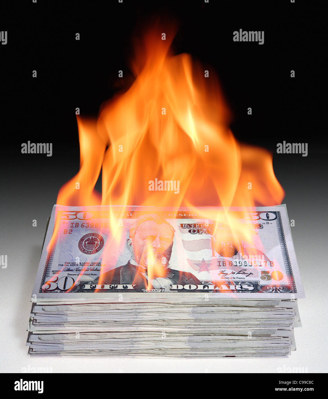 Pile of Dollar notes on fire Stock Photo - Alamy