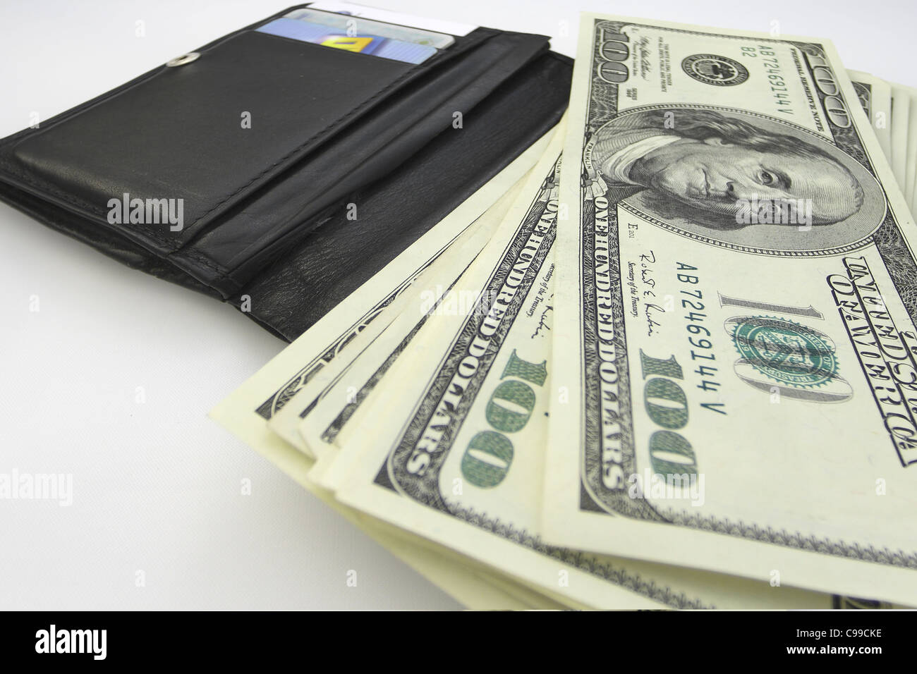 wallet and money on the white background Stock Photo - Alamy