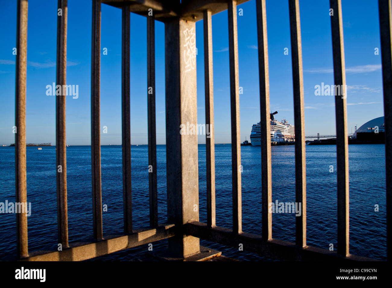 Looking at cruise ship through bars Stock Photo - Alamy
