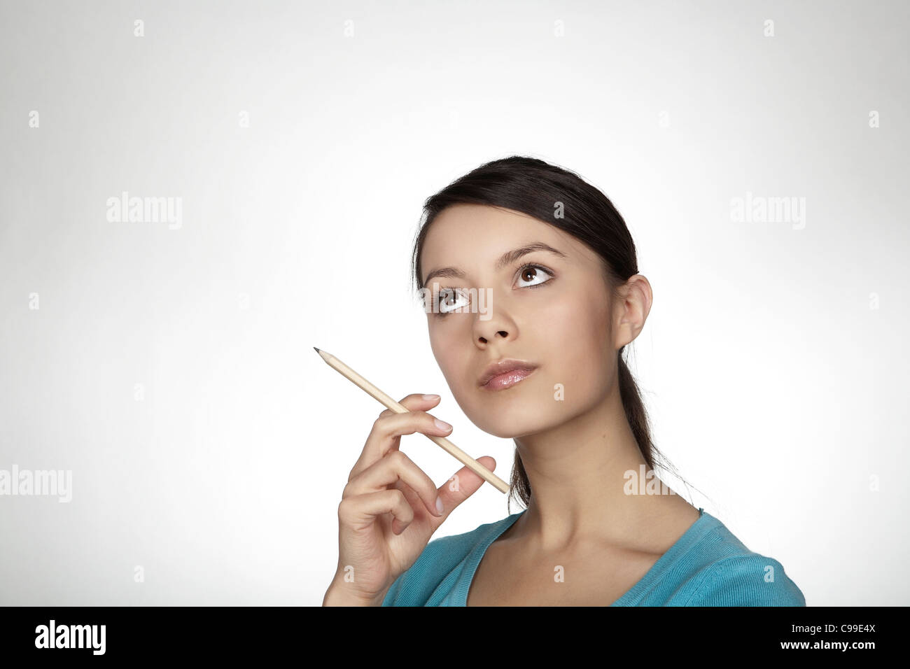 young girl thinking something over Stock Photo - Alamy