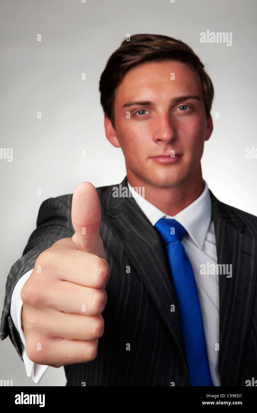 business man with his thumb up saying good job Stock Photo - Alamy