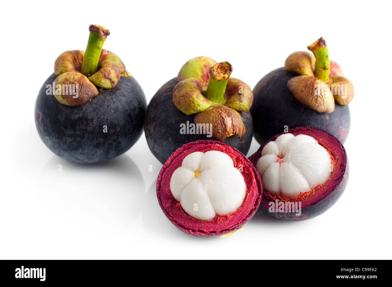 Mangosteen fruit and cross section showing the thick purple skin and ...