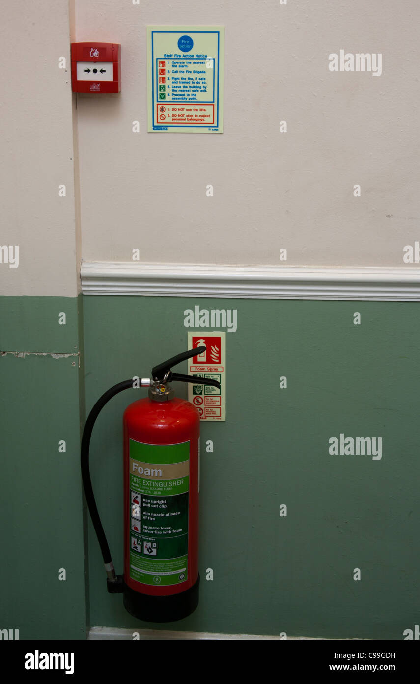 Green Wall with fixed Fire Extinquiser Fire Point Stock Photo - Alamy