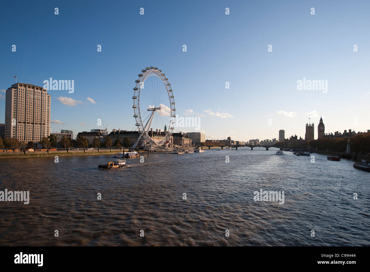 The iconic London Eye ferris wheel on the south bank of the river ...