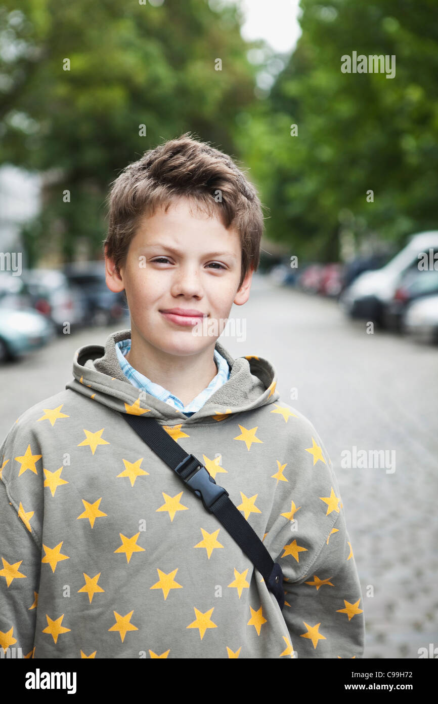 Germany, Berlin, Boy standing in street Stock Photo - Alamy
