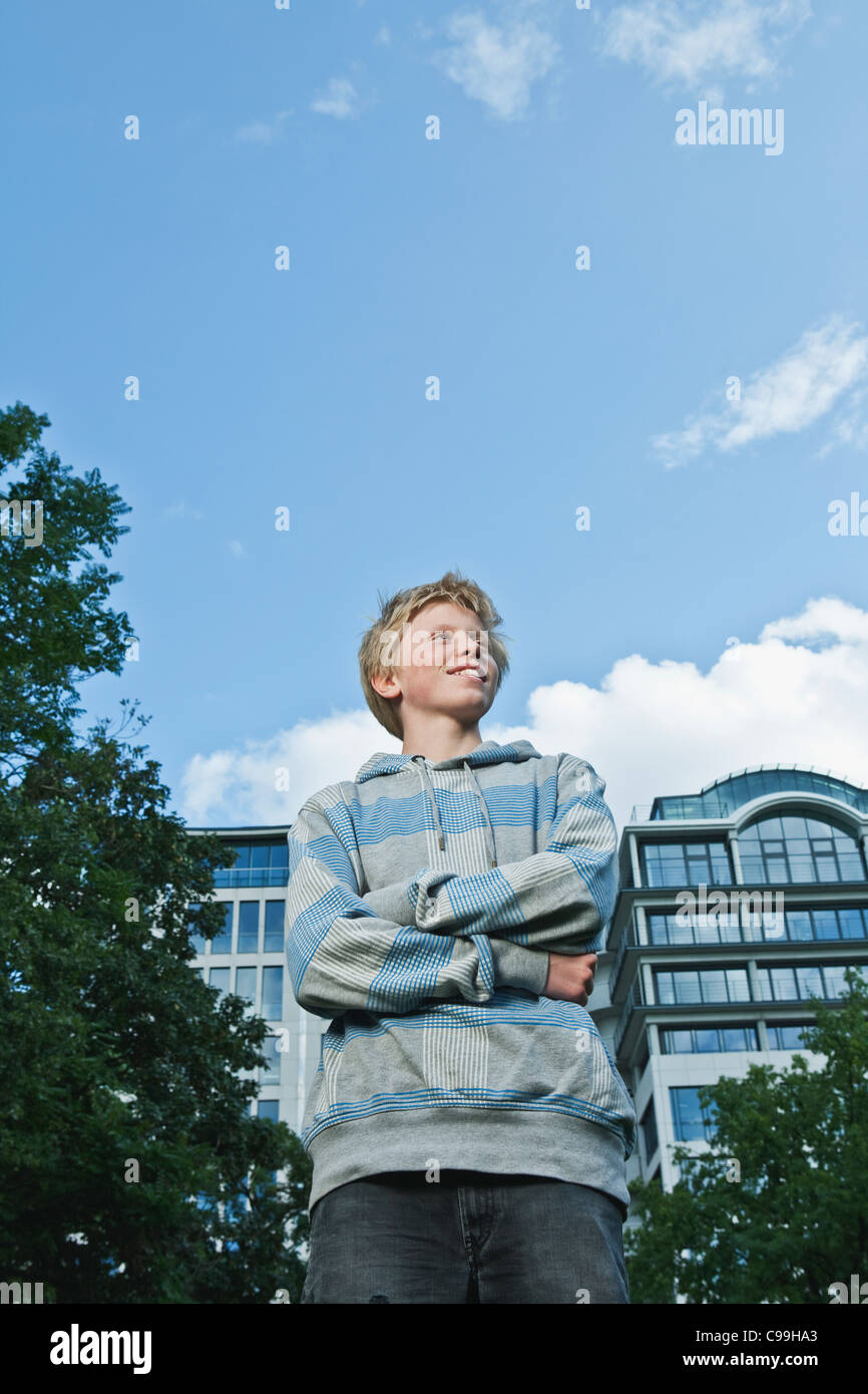 Germany, Berlin, Teenage boy standing in city Stock Photo - Alamy