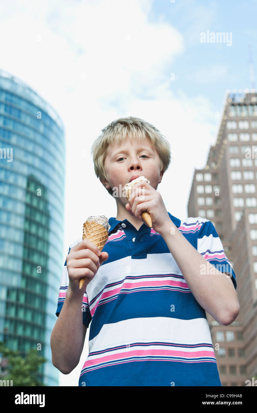 Boy standing ice cream cone hi-res stock photography and images - Alamy