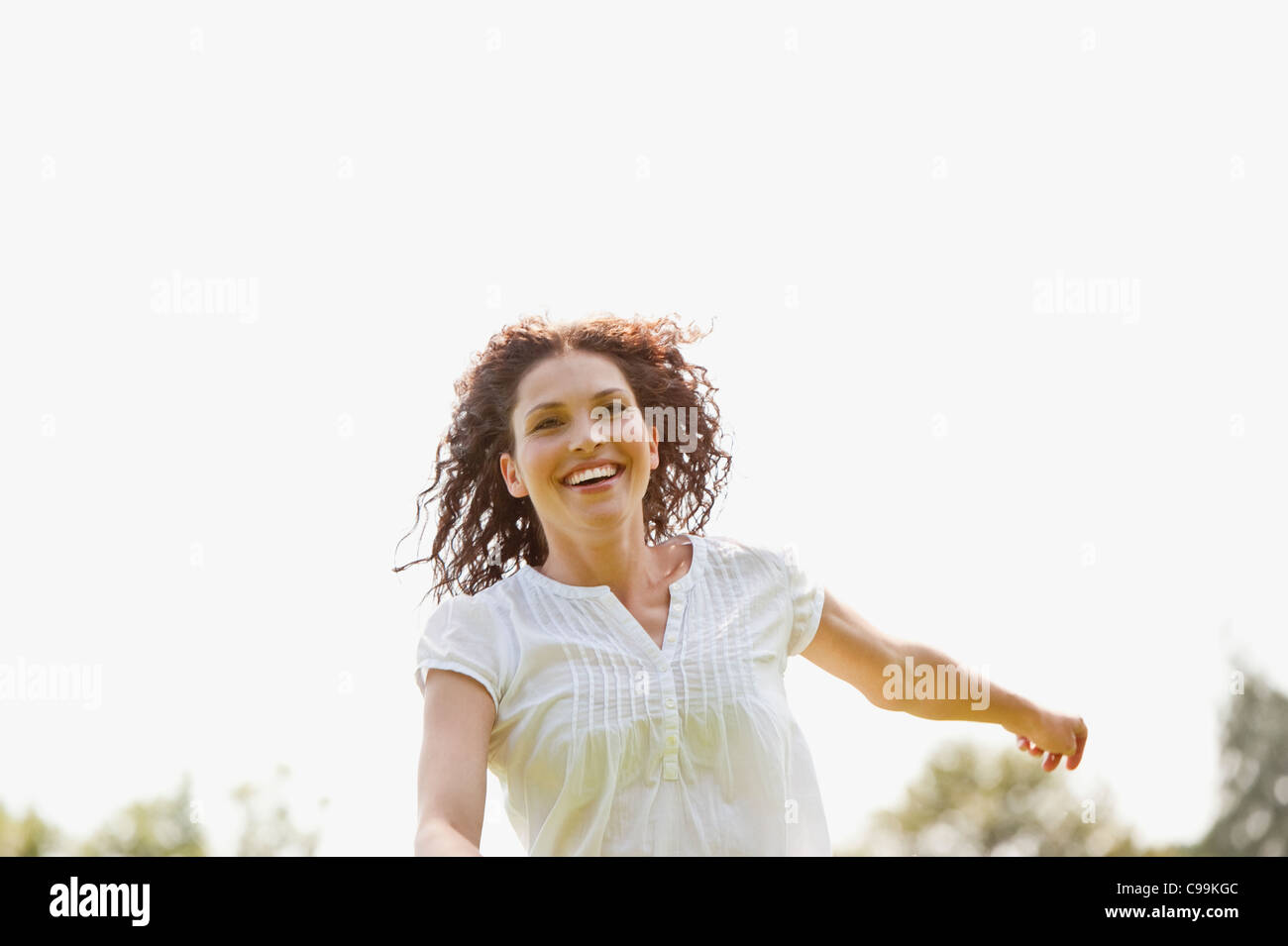 Germany, Bavaria, Mid adult woman running, smiling Stock Photo - Alamy