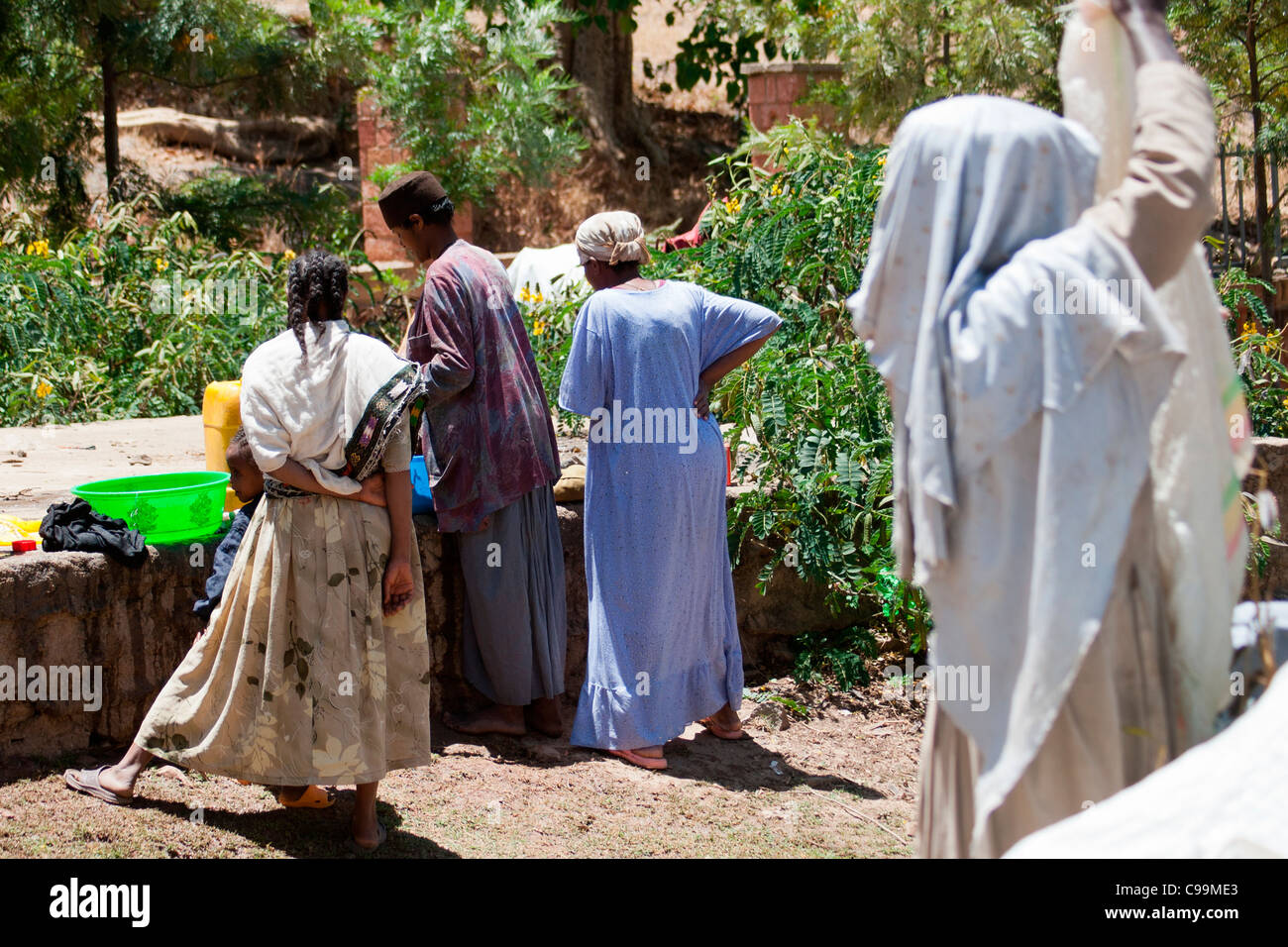 Ethiopian women washing clothes in hi-res stock photography and images ...