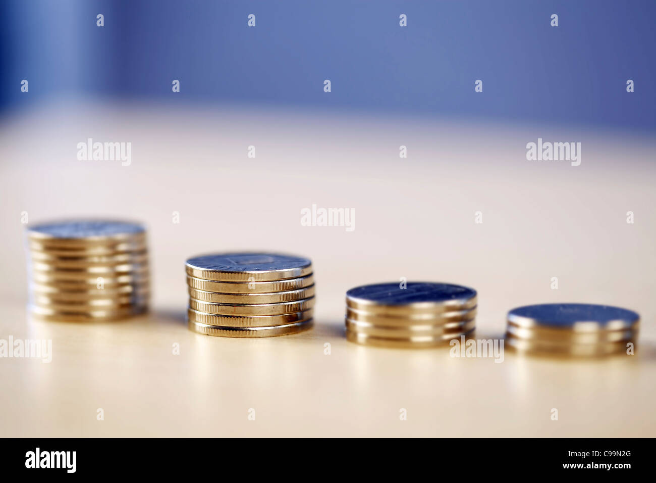 Many towers of money - progressive increase Stock Photo - Alamy