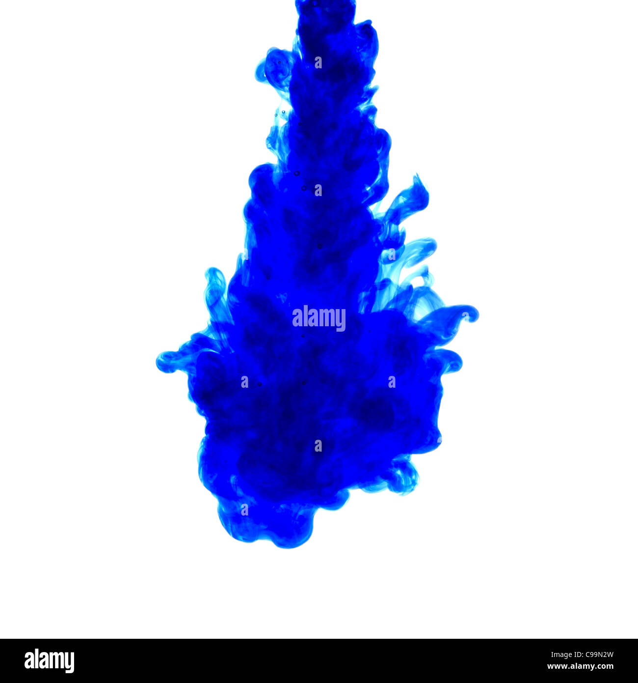 Side view of blue ink diffusing into a tank of water Stock Photo - Alamy