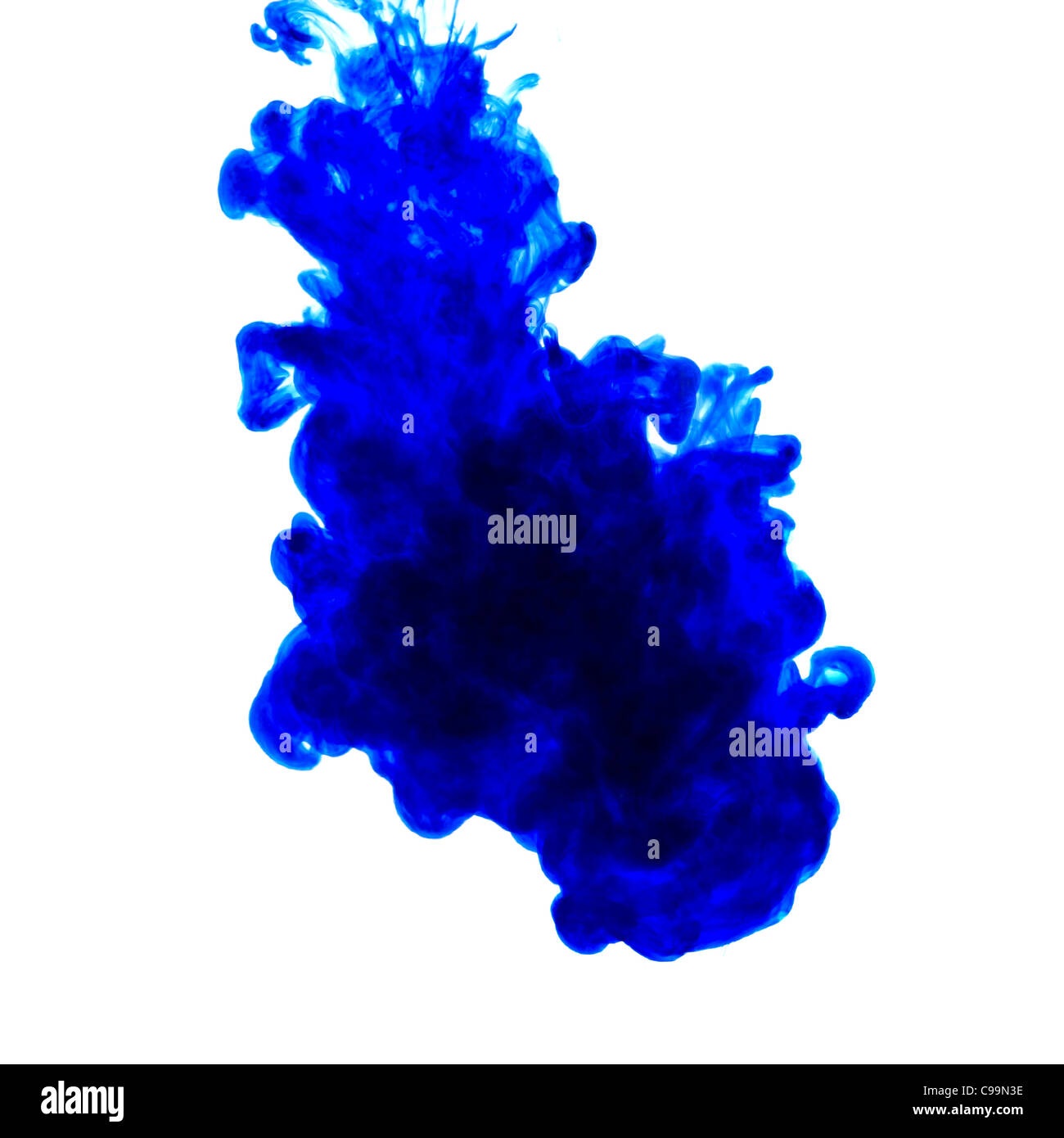Side view of blue ink diffusing into a tank of water Stock Photo - Alamy