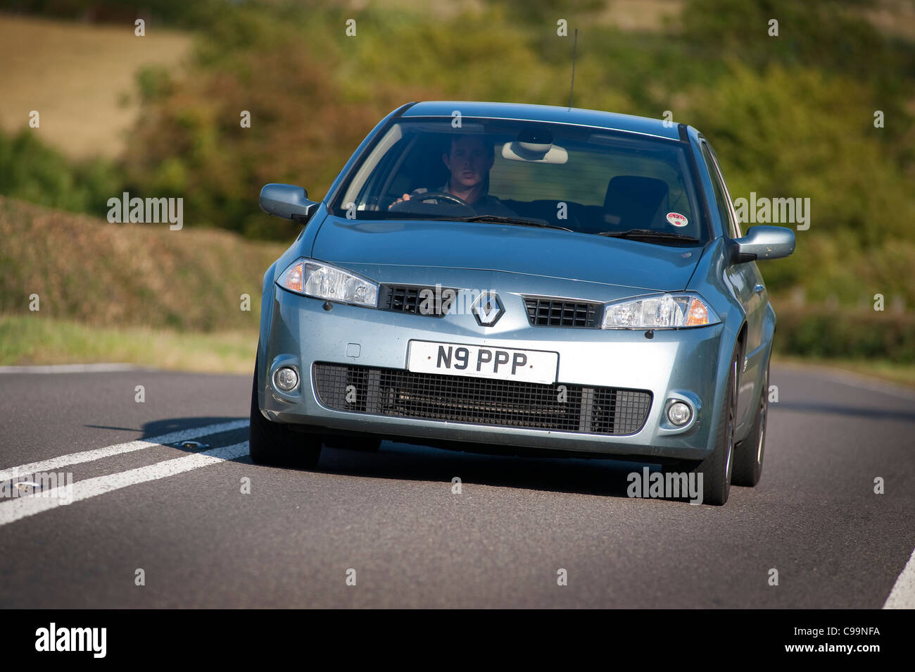Silver Renault car being driven through rural England Stock Photo - Alamy
