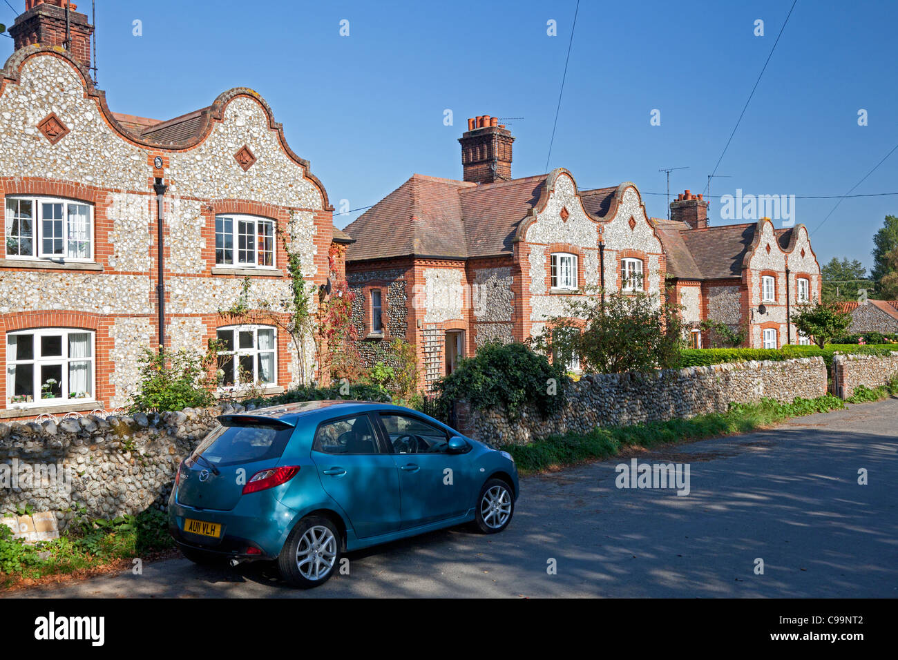 Flint and brick cottages with Flemish gables, Glandford, Norfolk Stock ...