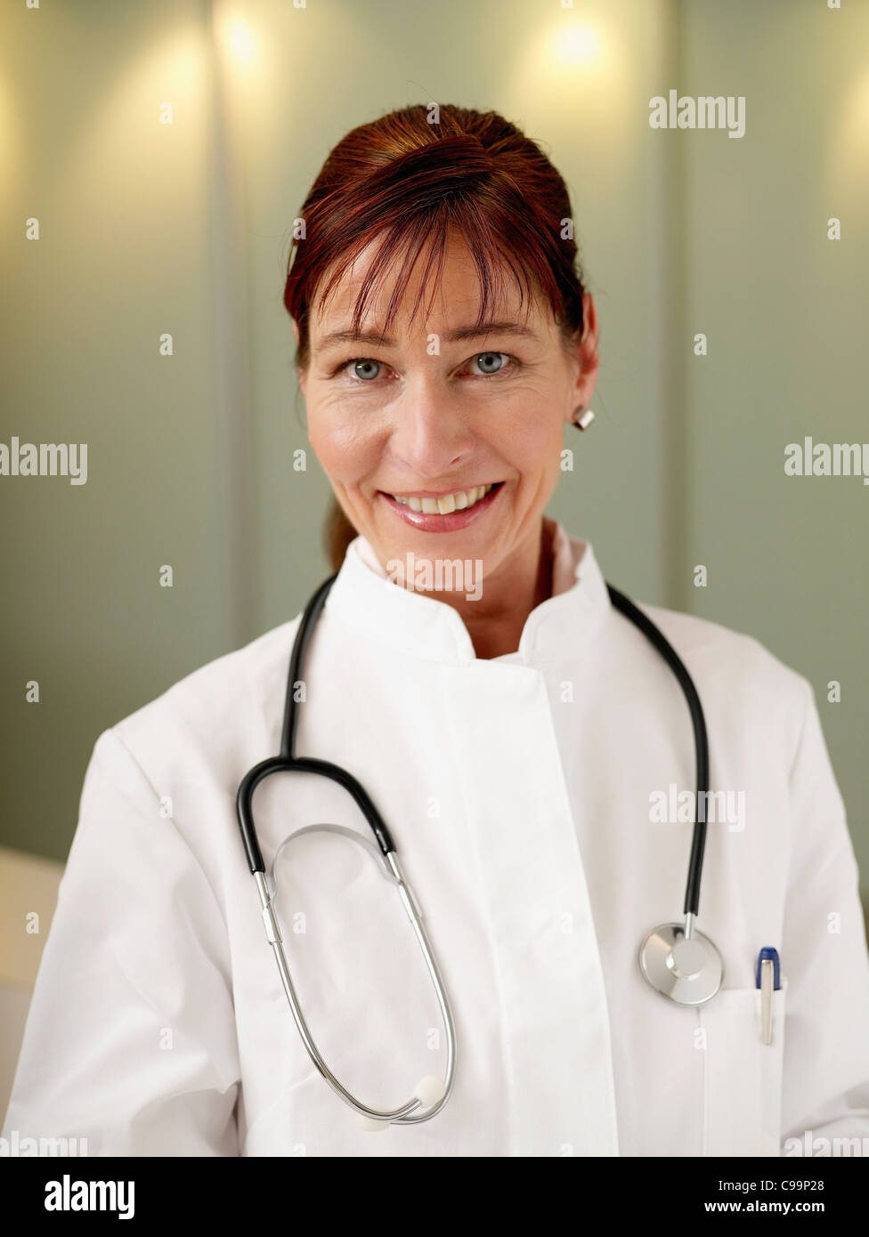 Germany, Hamburg, Female doctor smiling, portrait Stock Photo - Alamy