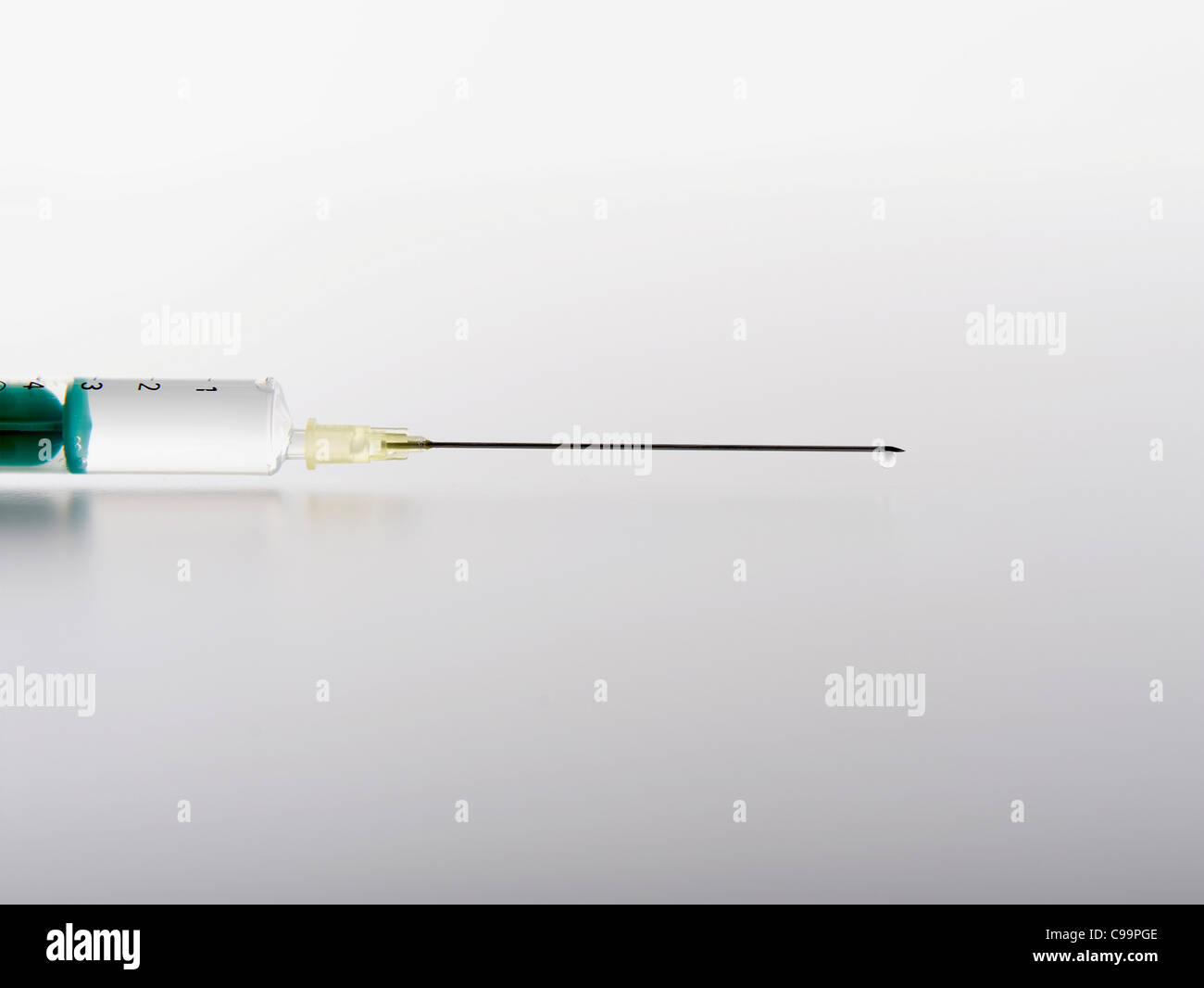 Syringe needle on white background, close up Stock Photo - Alamy
