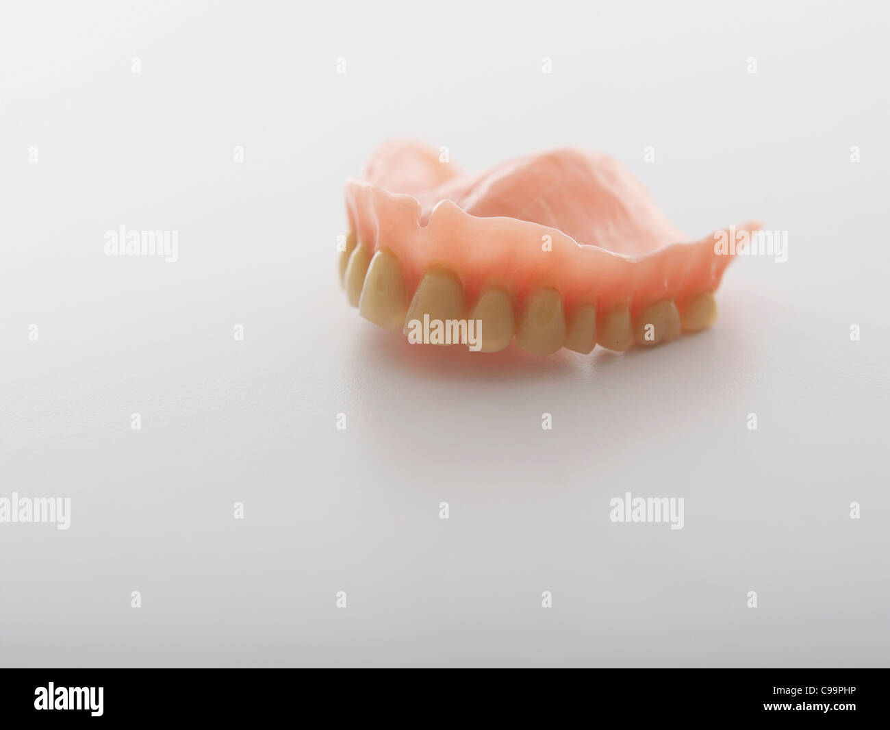 Dentures on white background, close up Stock Photo - Alamy