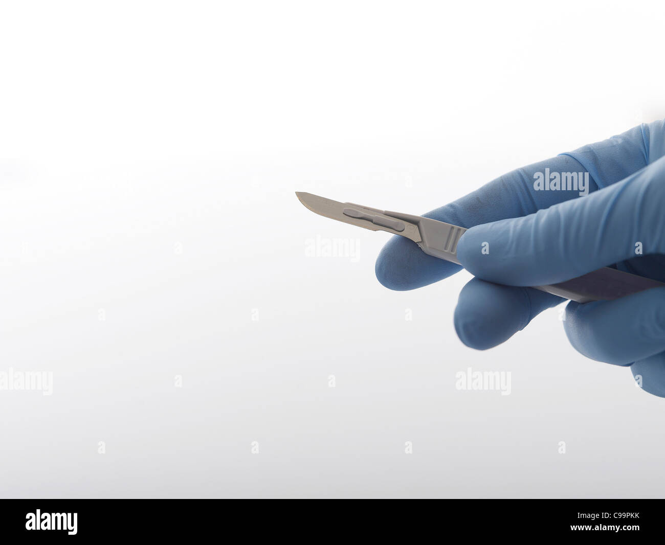 Doctor holding scalpel, close up Stock Photo - Alamy