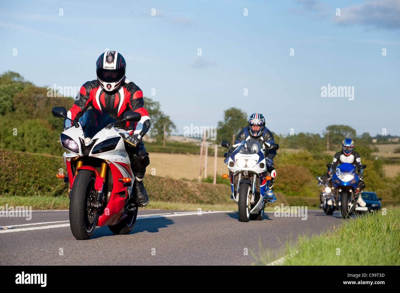 Motorcyclists riding along a rural road in England Stock Photo - Alamy
