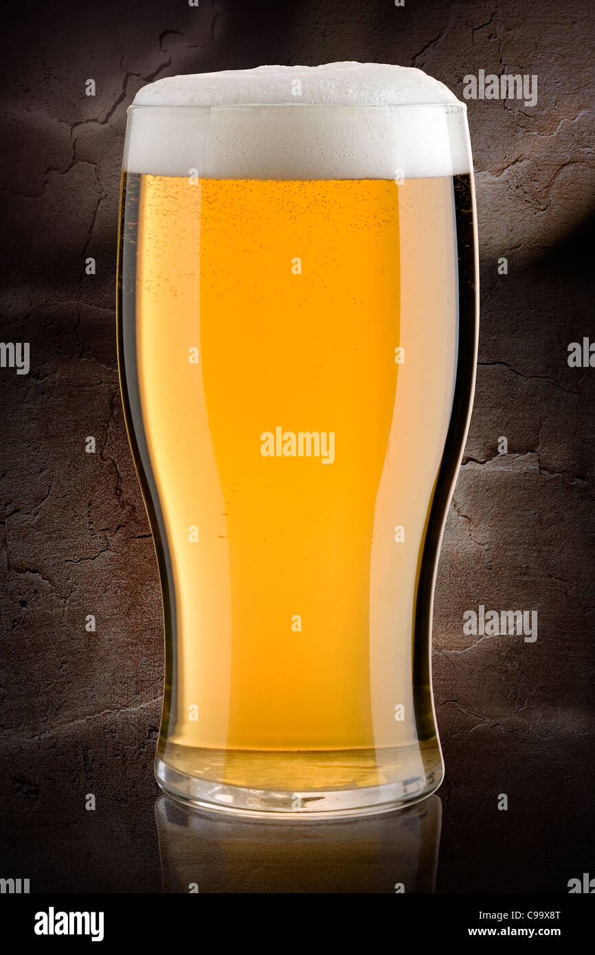 pint of cold lager against a stone backdrop Stock Photo - Alamy