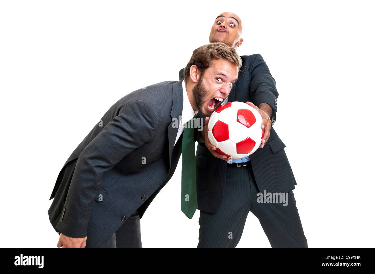 Team of businessmen with soccer ball Stock Photo - Alamy