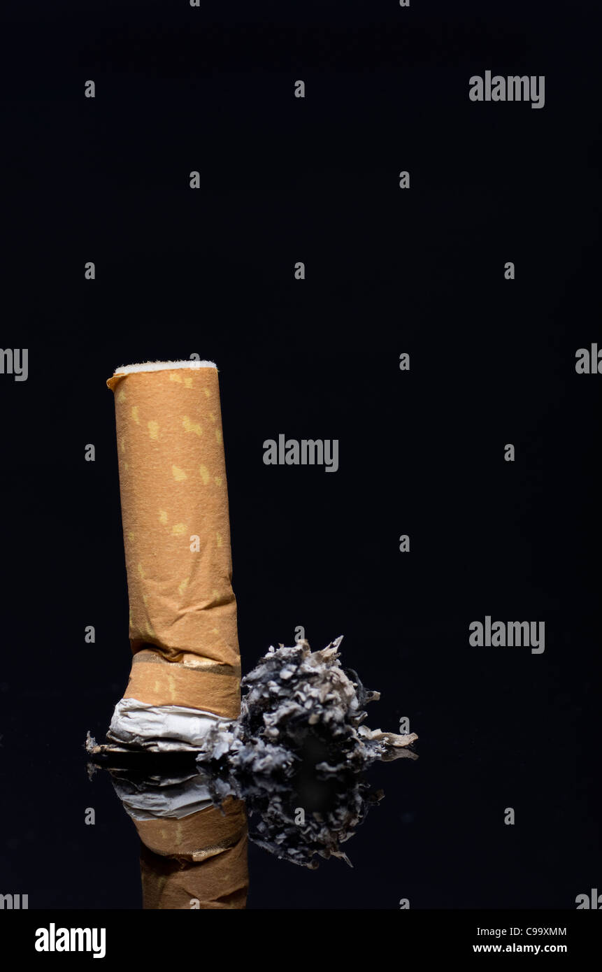 Burnt cigarette with ash on black background, close up Stock Photo - Alamy