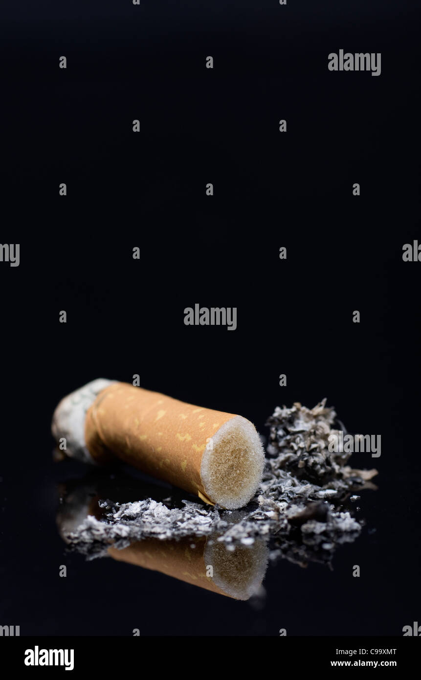 Burnt cigarette with ash on black background, close up Stock Photo - Alamy