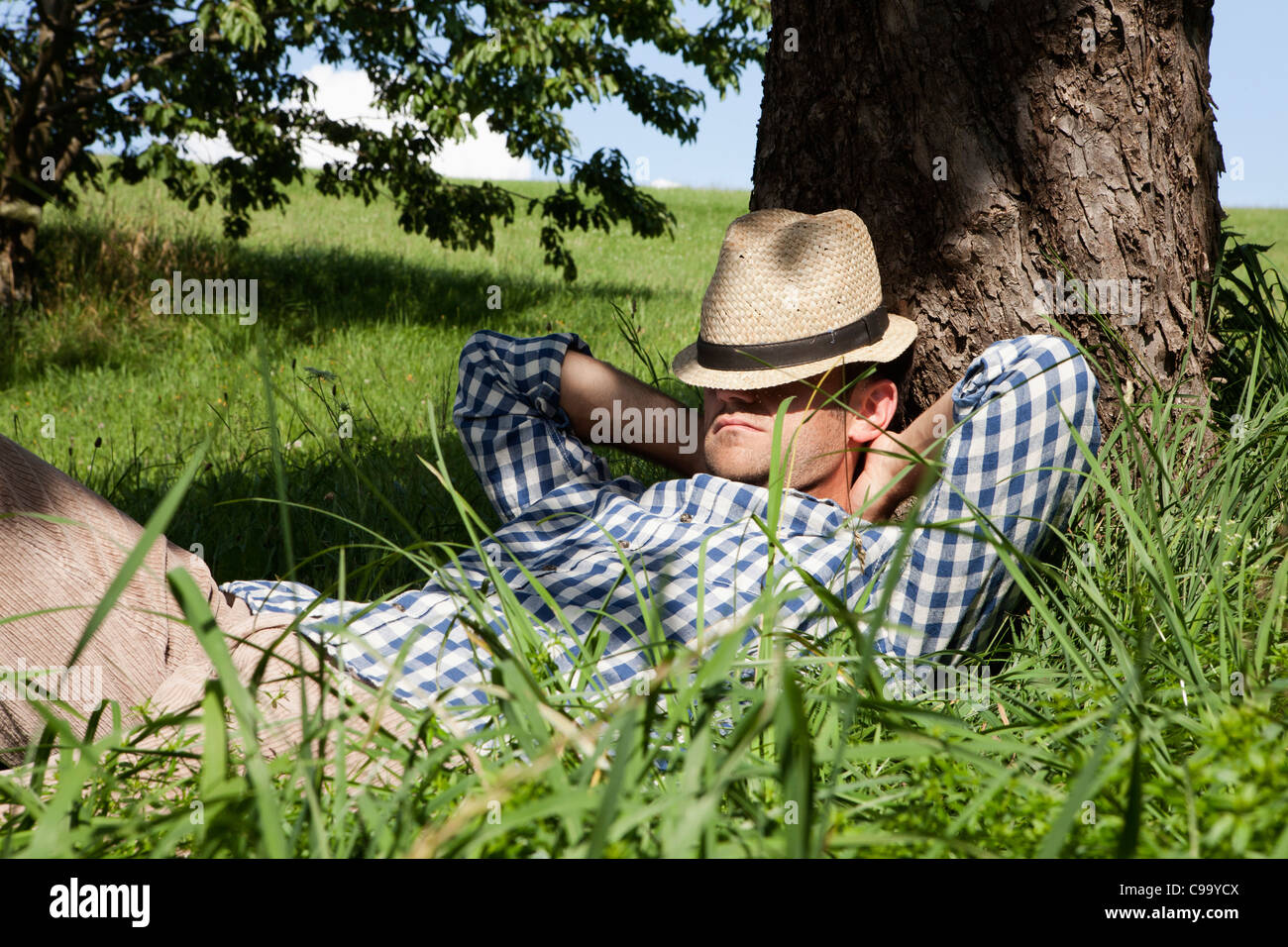 Resting under a tree hi-res stock photography and images - Alamy