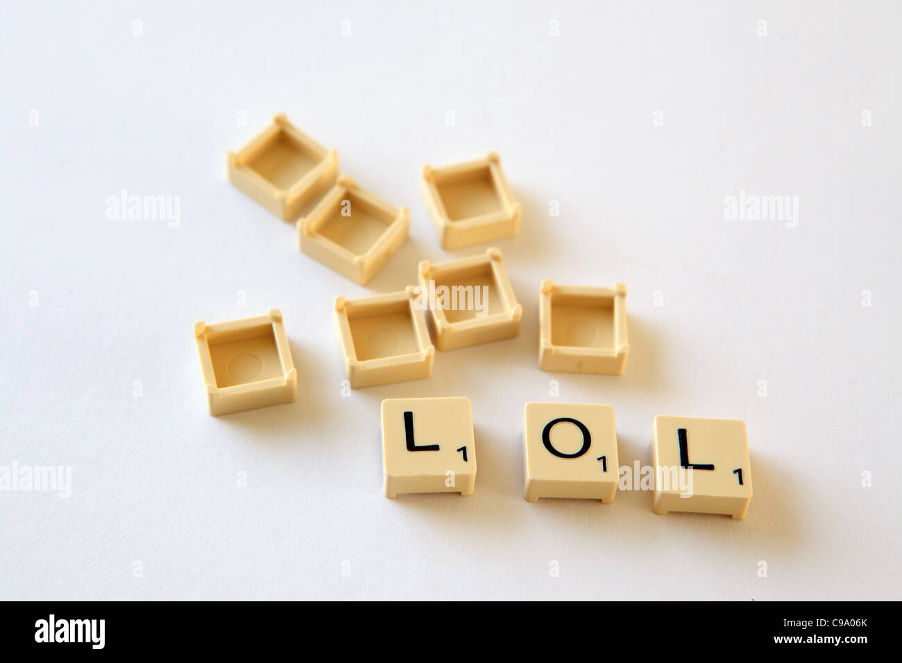 Scrabble tiles / squares spell out , white background studio photograph ...