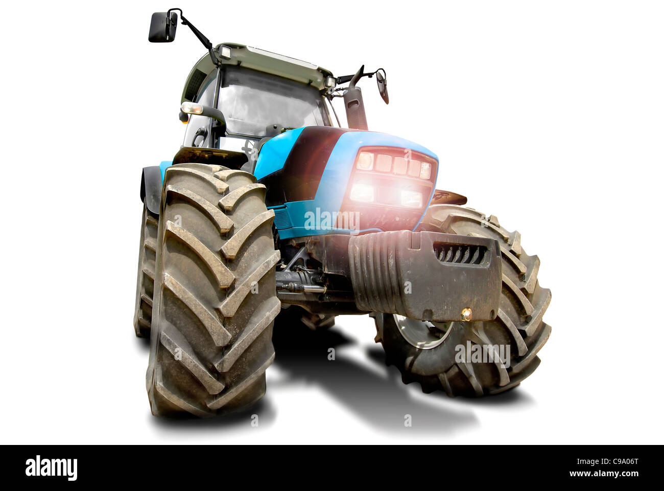 Blue tractor in a white background Stock Photo - Alamy