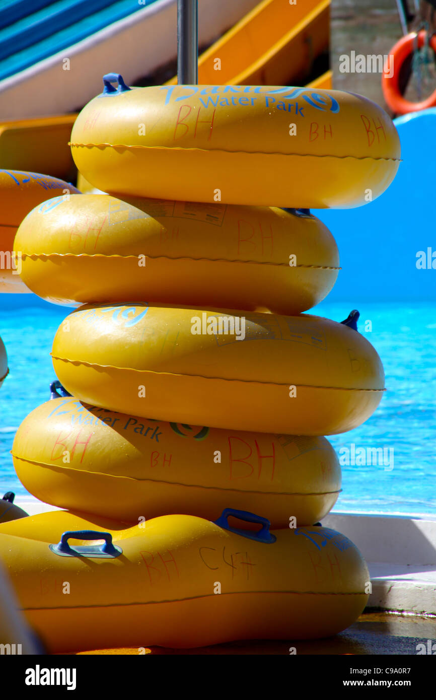 Stack of inflatable rings at water park Stock Photo - Alamy