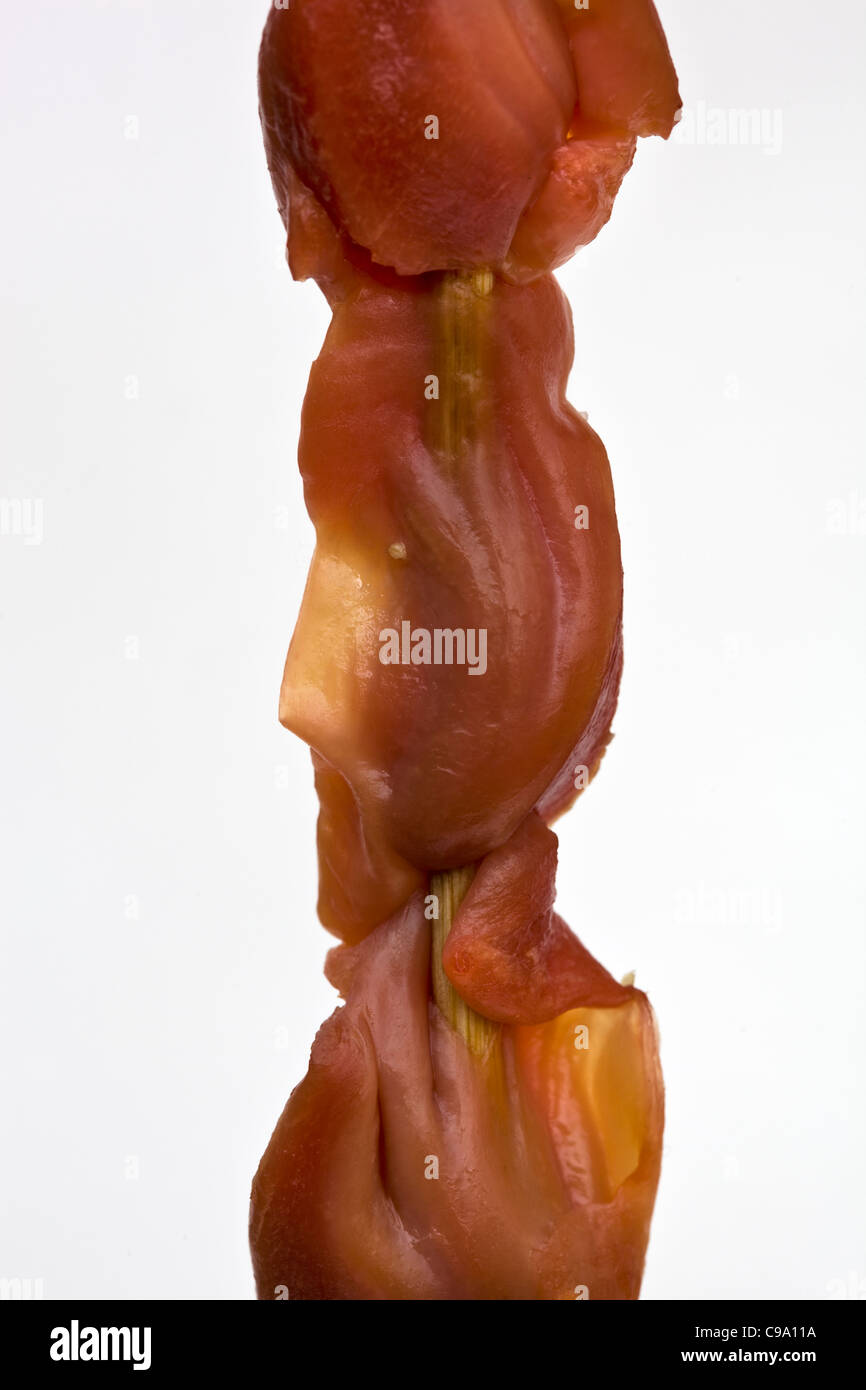 Raw Chicken Gizzard on a stick ready for cooking at at Donghuamen night ...