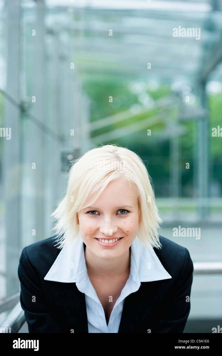 Germany, Bavaria, Munich, Young woman smiling, portrait Stock Photo - Alamy