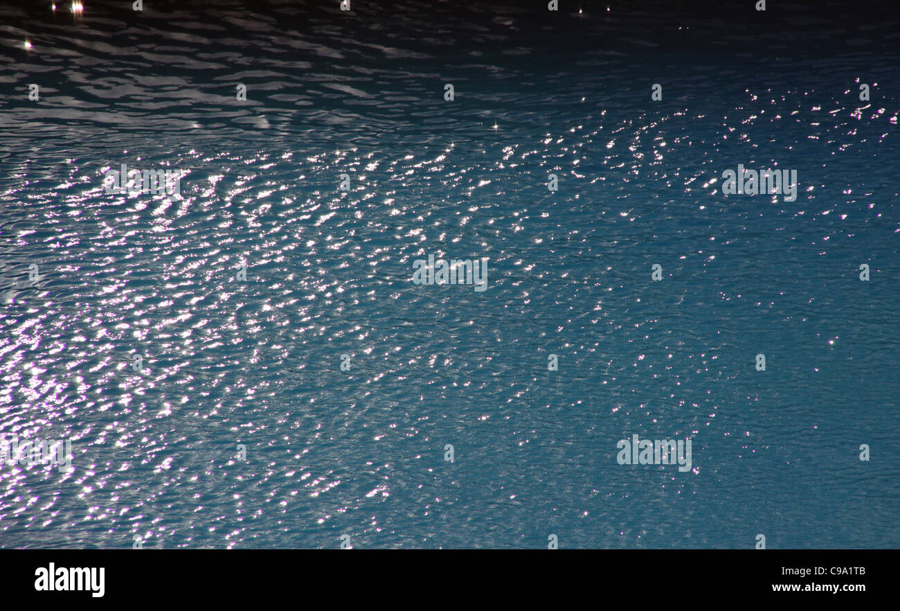 Sun reflecting on rippled water Stock Photo - Alamy