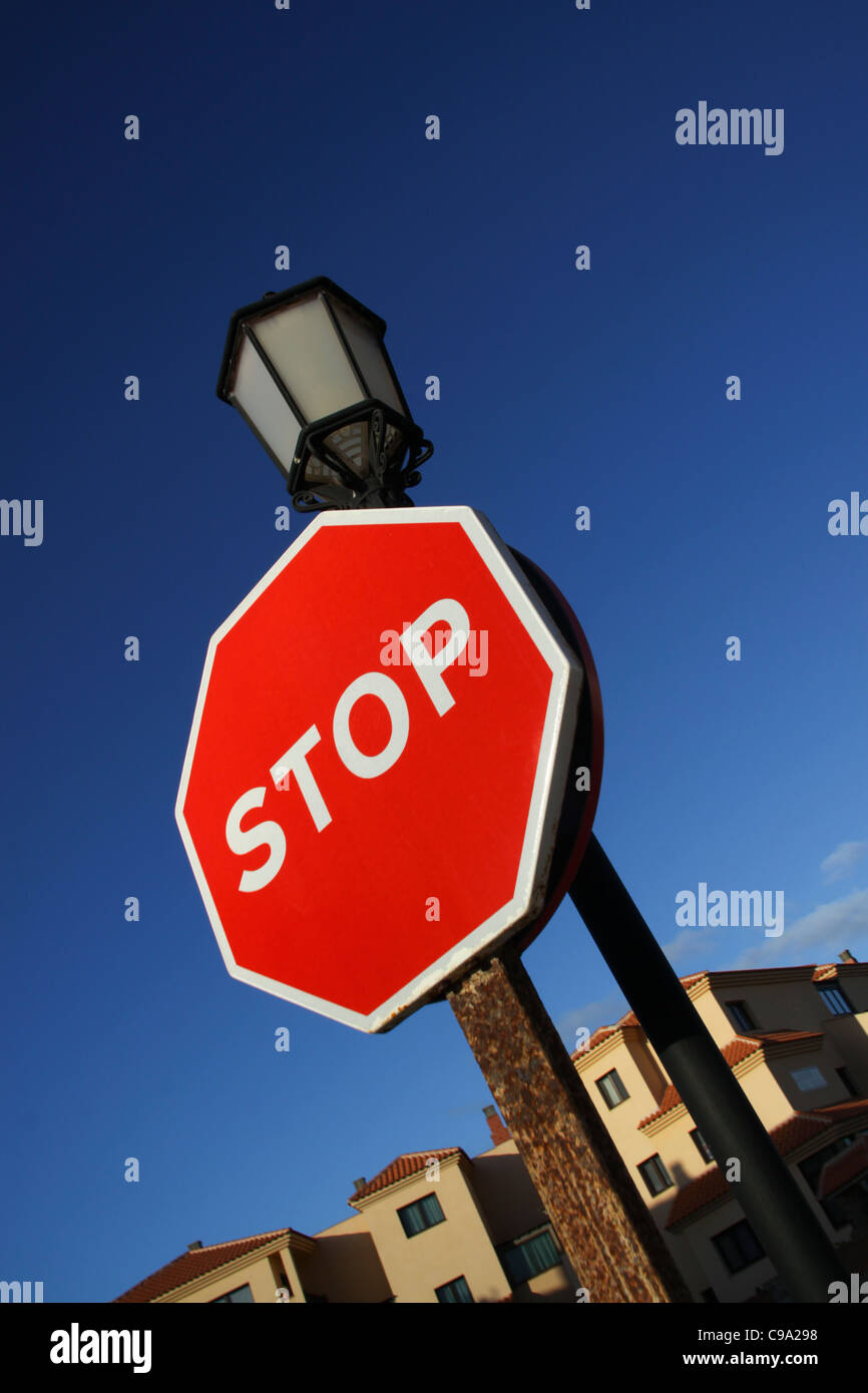 Octagonal red stop road sign Stock Photo - Alamy