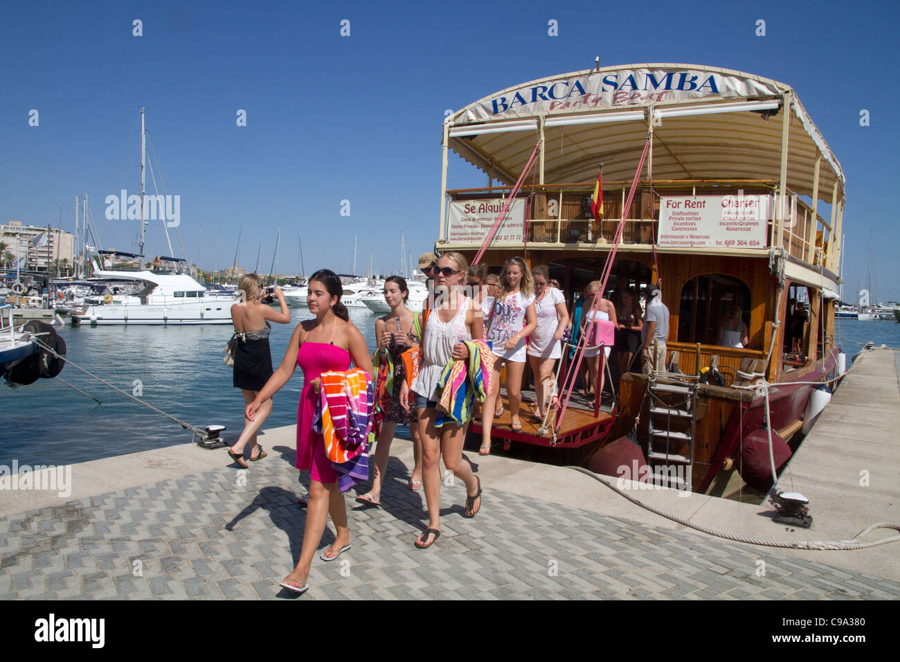 Group of Young tourist down of boat for tour Mallorca Majorca Balearic ...