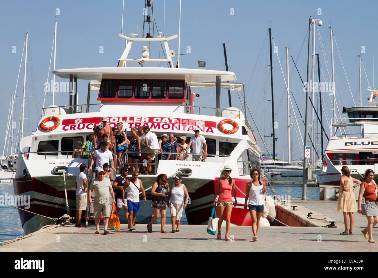 Group of Young tourist down of boat for tour Mallorca Majorca Balearic ...