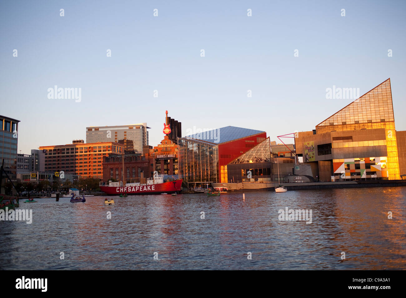 The sun sets over Baltimore, Maryland's Inner Harbor. The historic ...