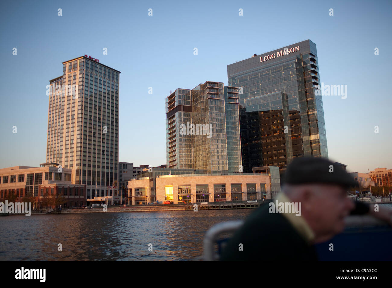 The sun sets over Baltimore, Maryland's Inner Harbor. The historic ...