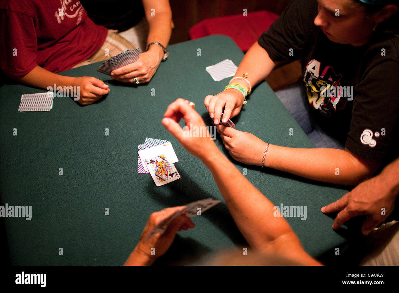 Four children play a game of cards on Cape Cod in East Orleans ...