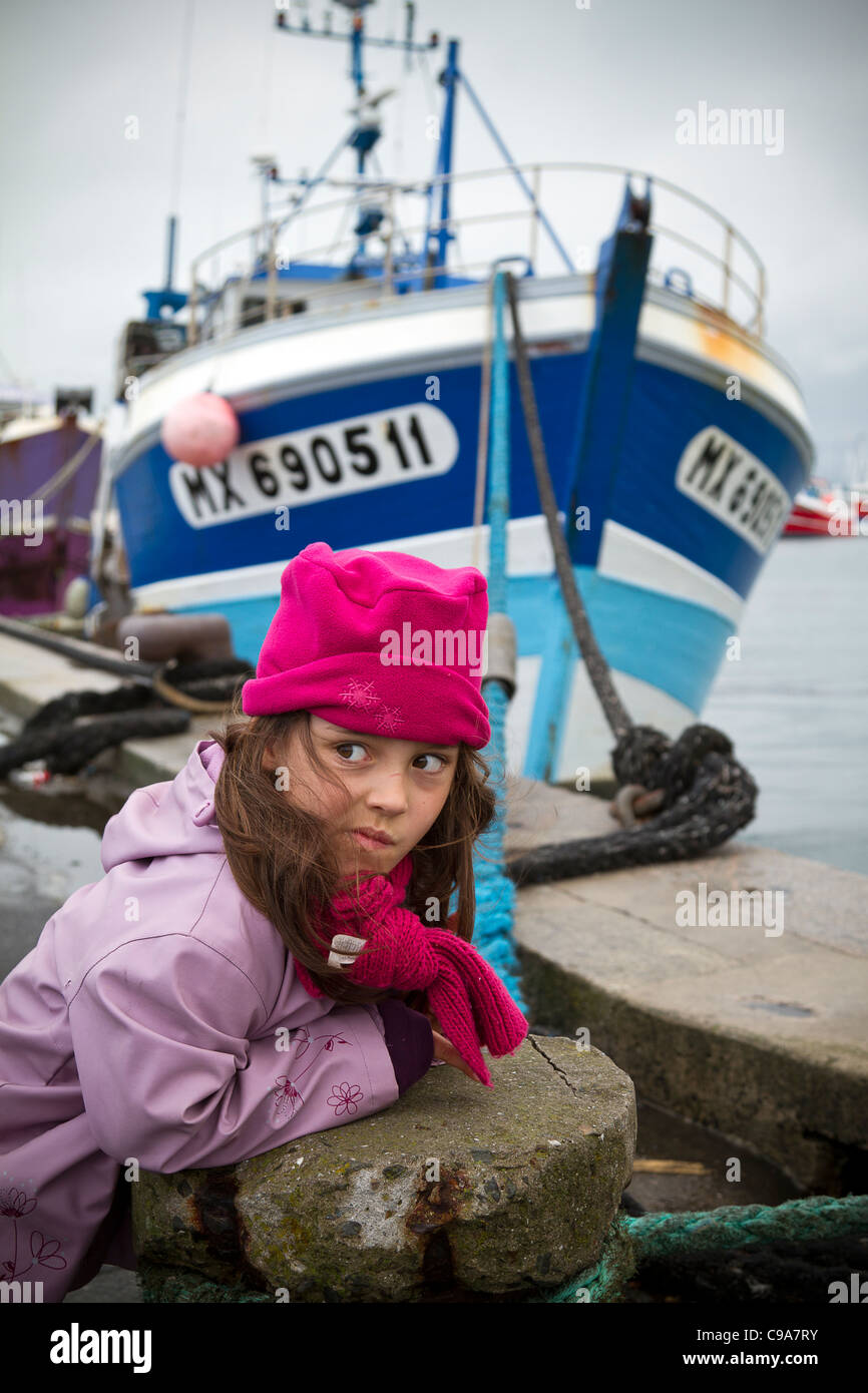 A young girl in front of a trawler Roscoff Brittany France Stock Photo ...