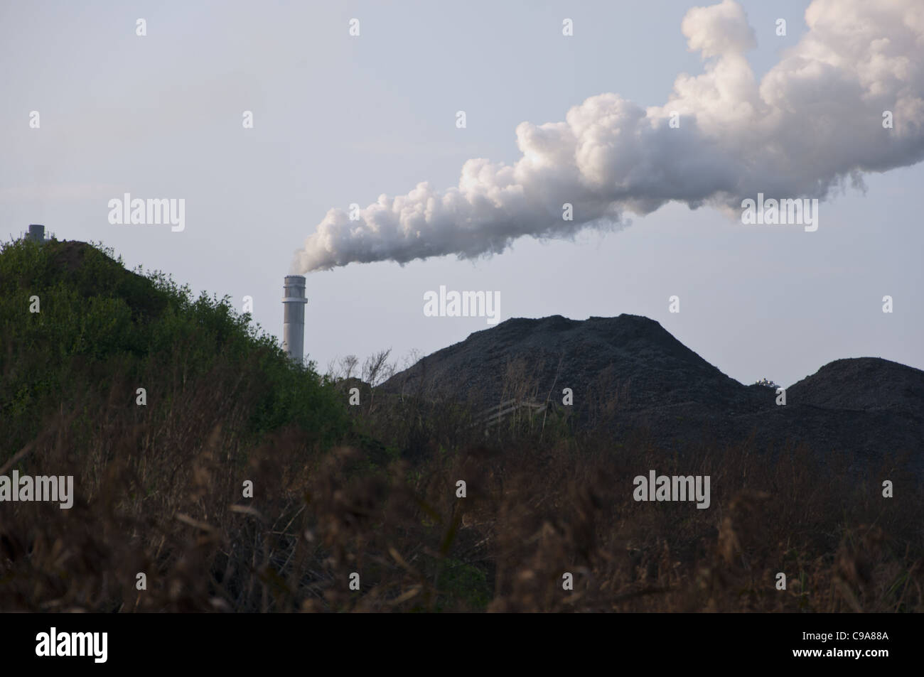 Industrial landscape chimney stack smoke Stock Photo - Alamy